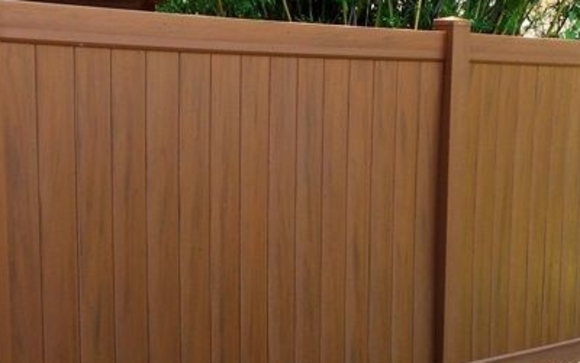 Homeland Wodgrain Vinyl Fence by Big Sun Fencing, Inc. in Ocala, FL ...